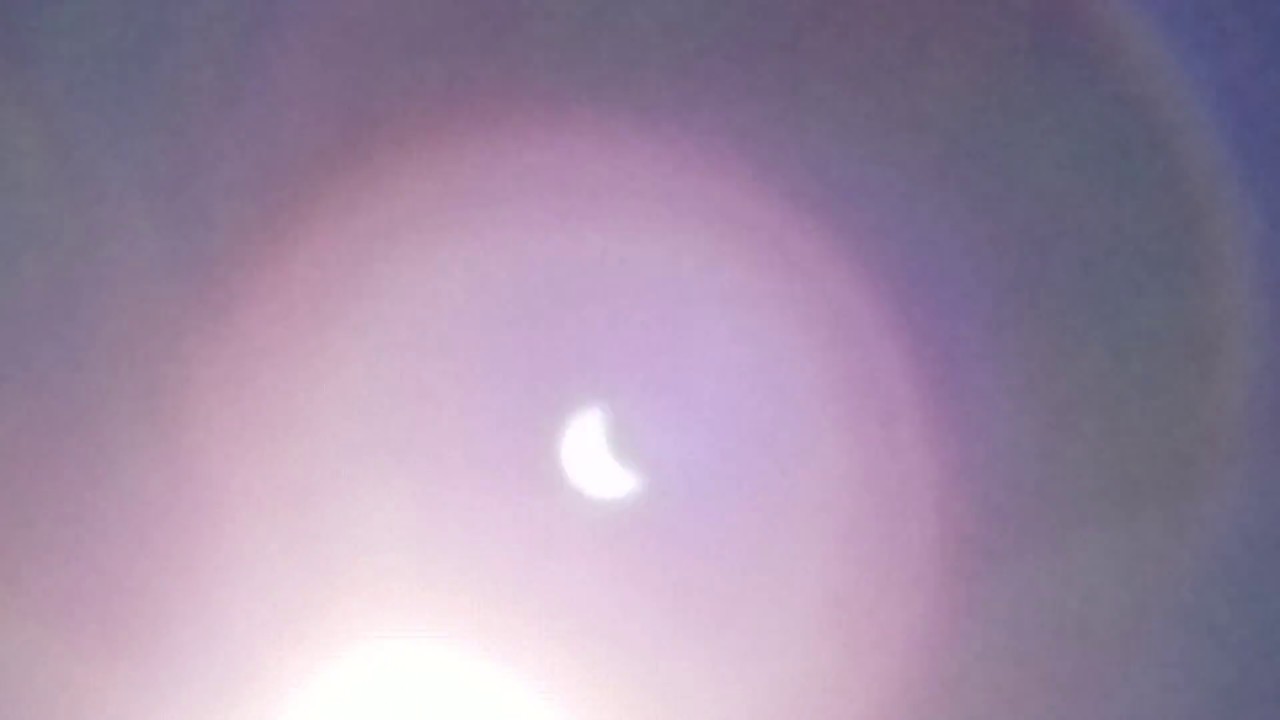STRANGE WHITE ORBS AROUND SUNS ECLIPSE - YouTube