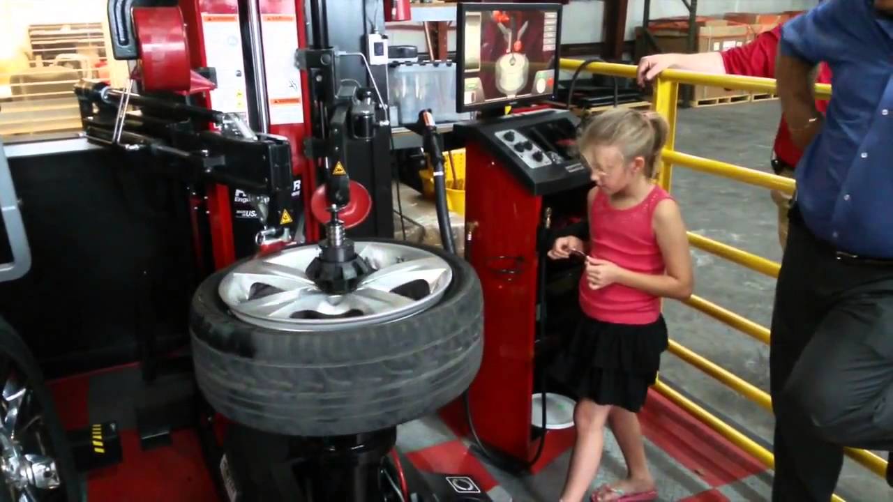 8 Year Old Changing A Tire The Revolution Tire Changer - YouTube
