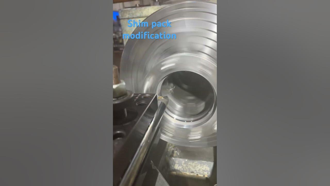 Modifying a shim pack for a bearing shell using a clamping fixture #lathe #machining # ...