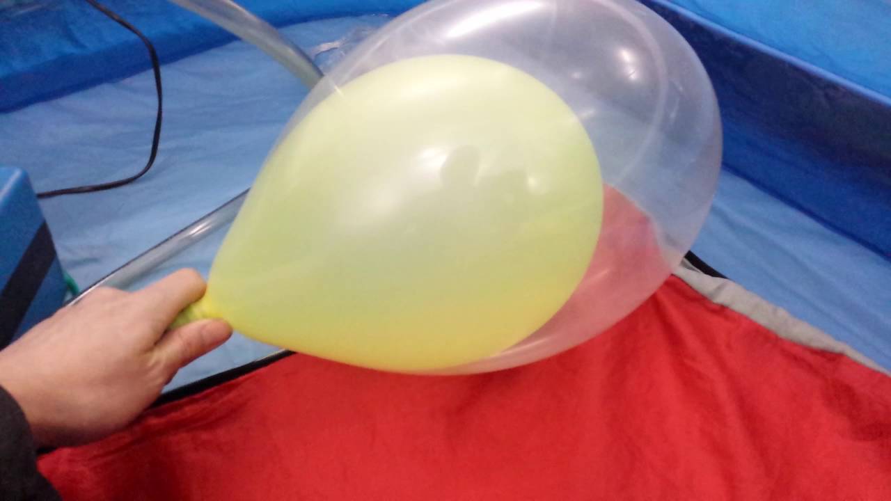 Neon balloon in balloon pump to pop - YouTube