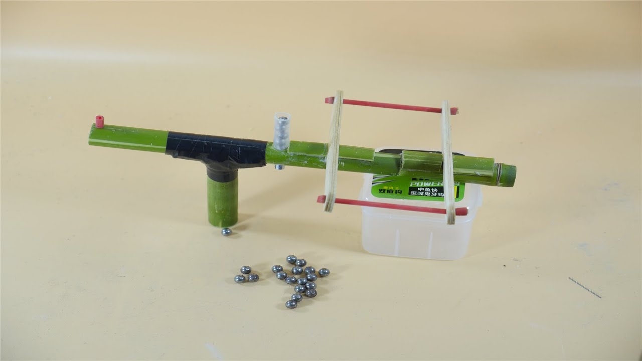 How to make a bamboo toy gun Note that it can launch marbles - YouTube
