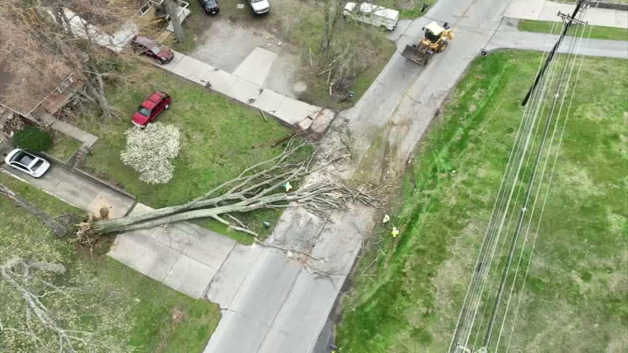 Aerials of crews cleaning up downed trees near Louisville's Cloverleaf ...