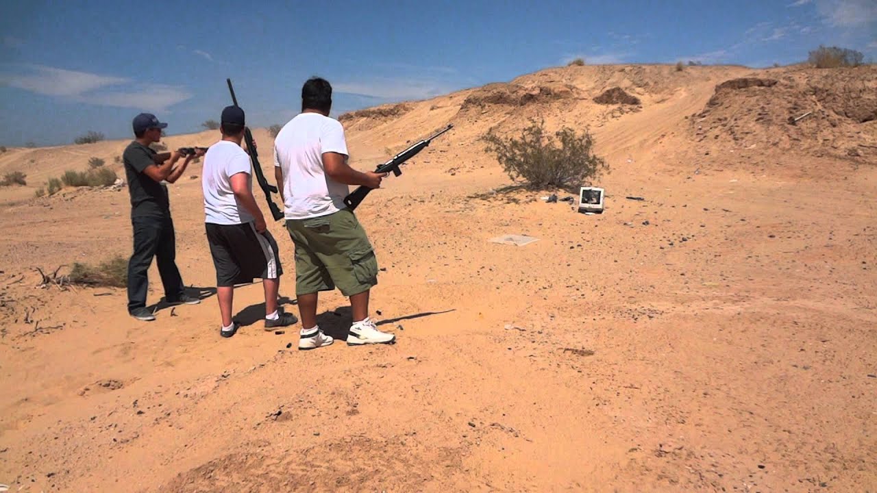 3 guys shooting a computer monitor - YouTube