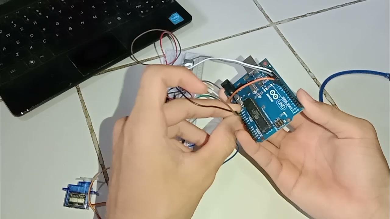 UTS PROJECT KENDALI SERVO MENGGUNAKAN SENSOR ULTRASONIK DENGAN ...