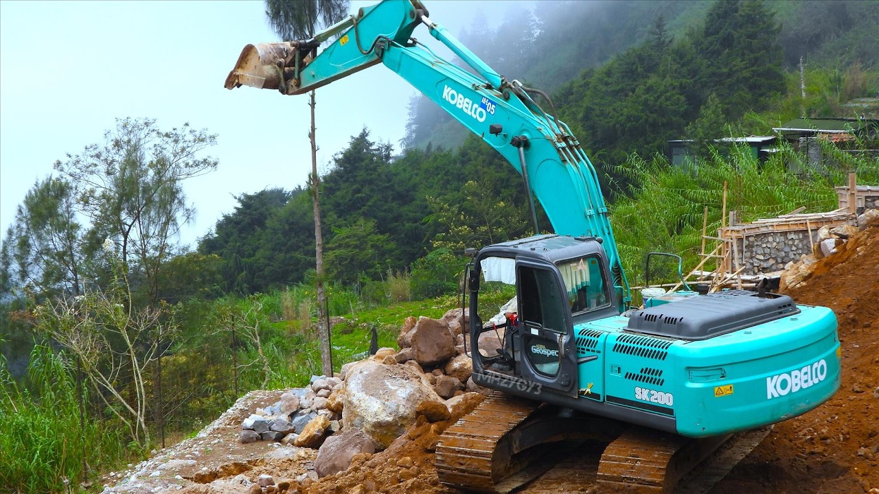 Kobelco Excavator Digging Excavating Hill Slope For The Embankment ...