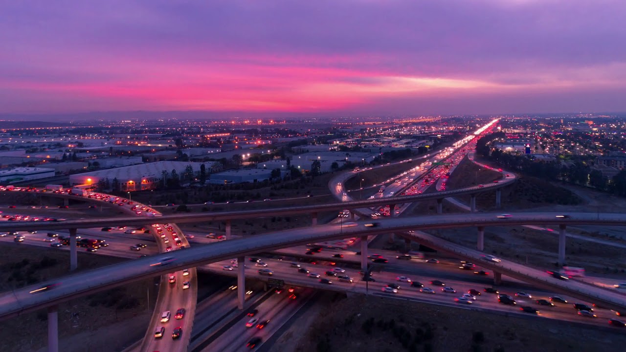 aerial hyper lapse of cars on freeway and highway with lights in - YouTube