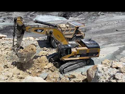 Caterpillar 385C Excavator Loading Blasted Materials & Rocks On Trucks & Dumpers - Pyramis Ate