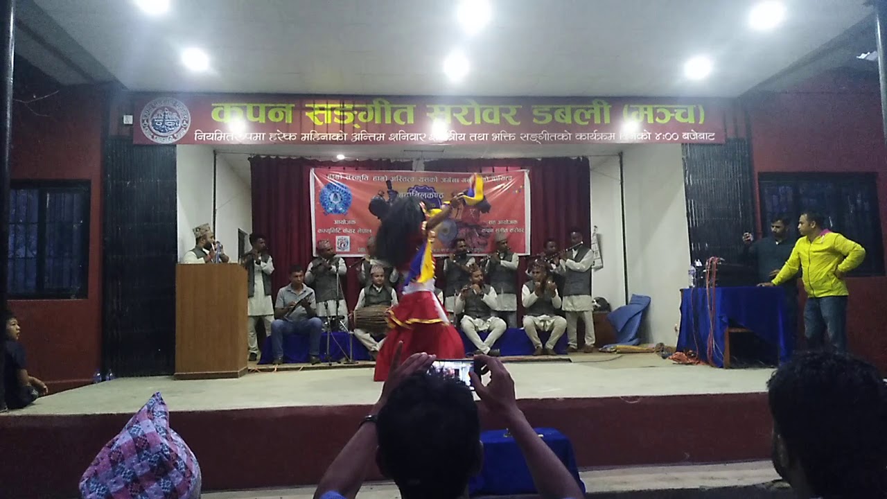 Presenting lakhe nach on traditional program - YouTube
