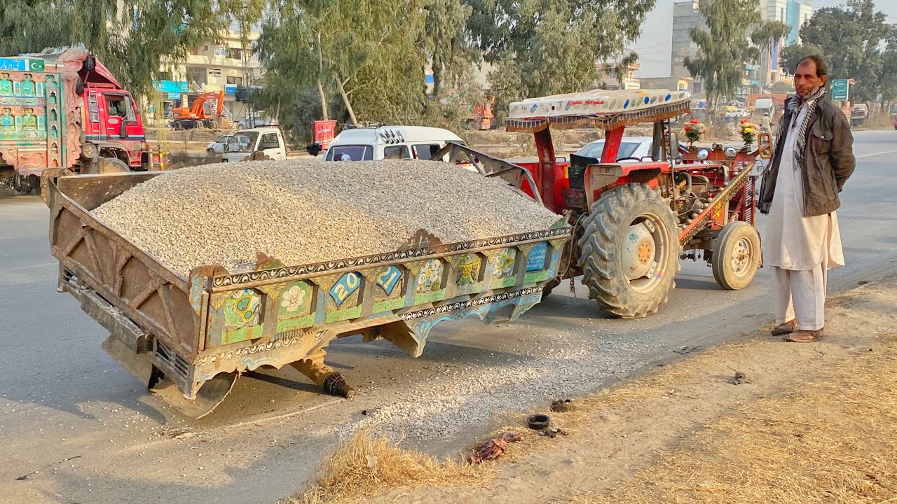 Overloaded Tractor Trolley Accident on Busy Road - YouTube