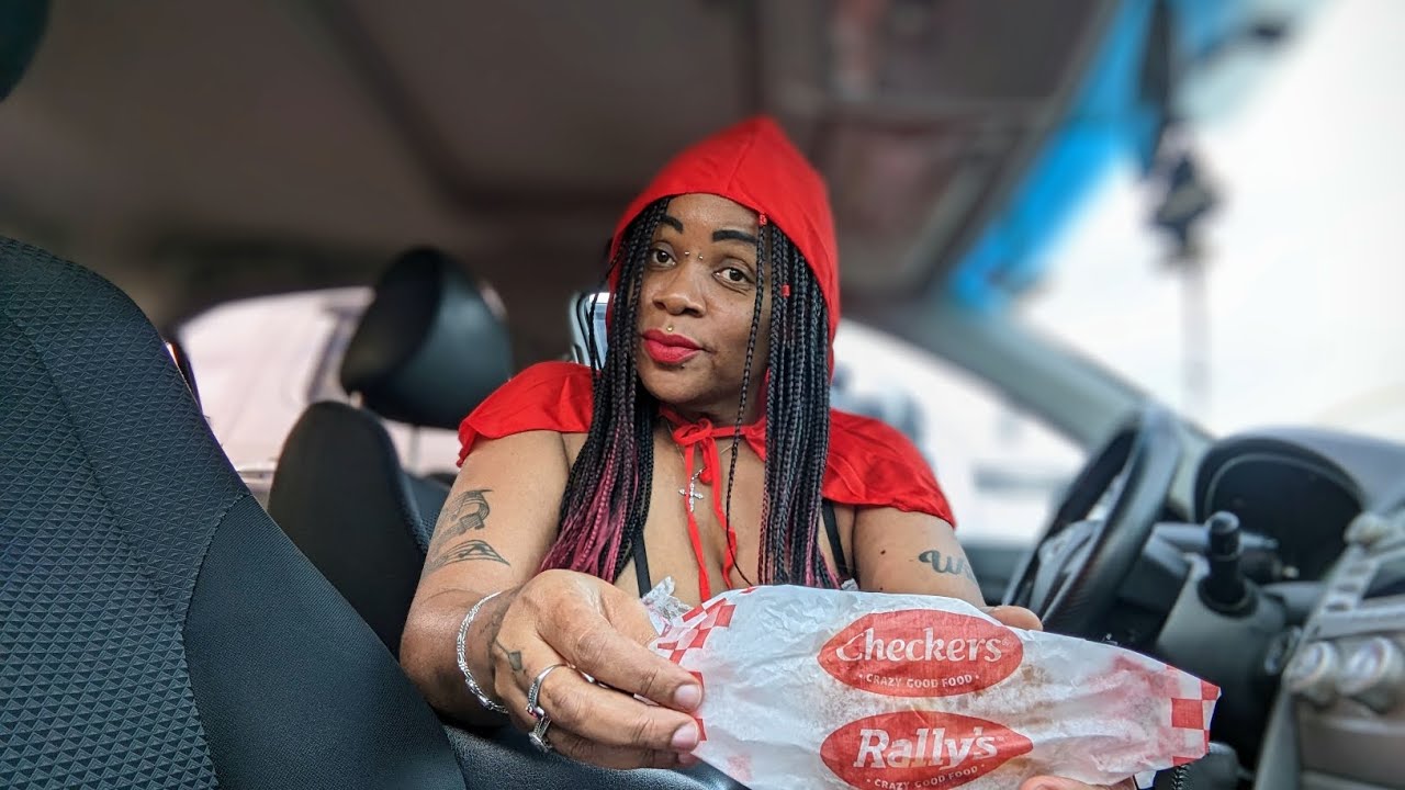 Spicy red riding hood stopped to eat a burger before the Halloween ...