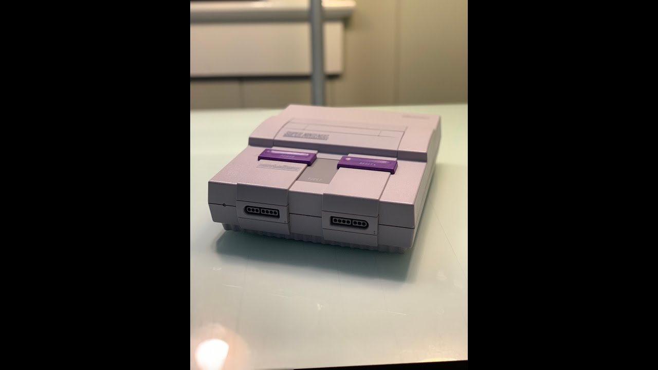 Taking apart a SNES, and putting it back together - YouTube