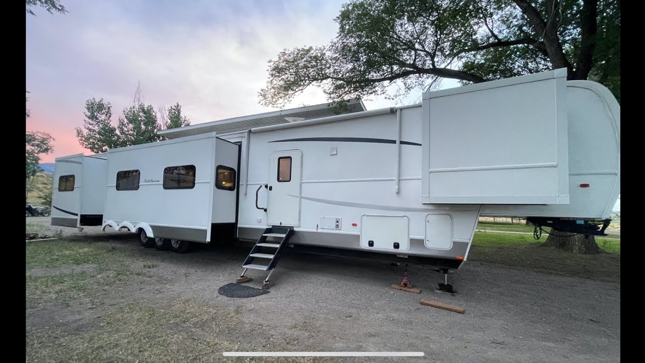 Spacious Living: Huge Custom 54' Trailer with 7 Slides! - YouTube