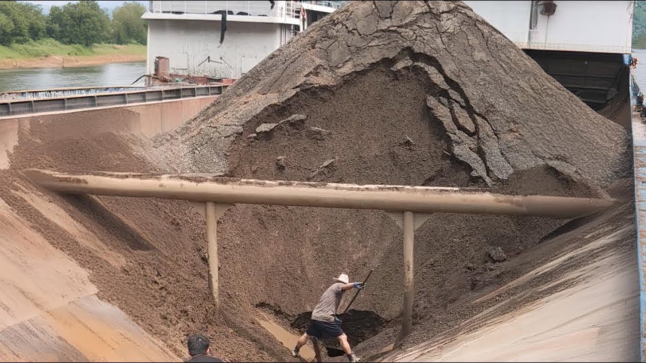 The barge is unloading 3,500 tons of sand and gravel from the first ...