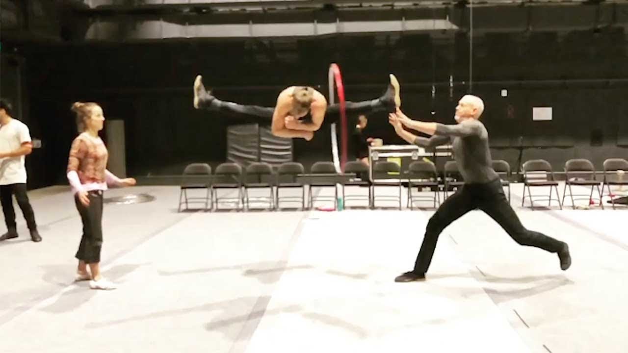 Gymnast Jumps Through Hoop With Mid-Air Split - YouTube