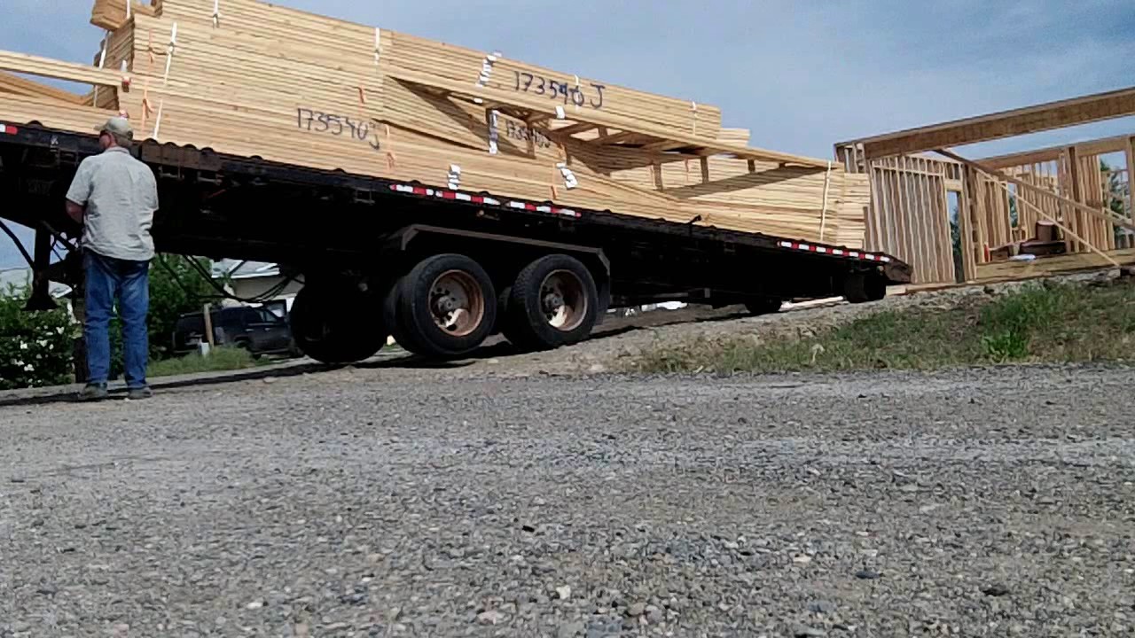 Unloading Roof trusses - YouTube