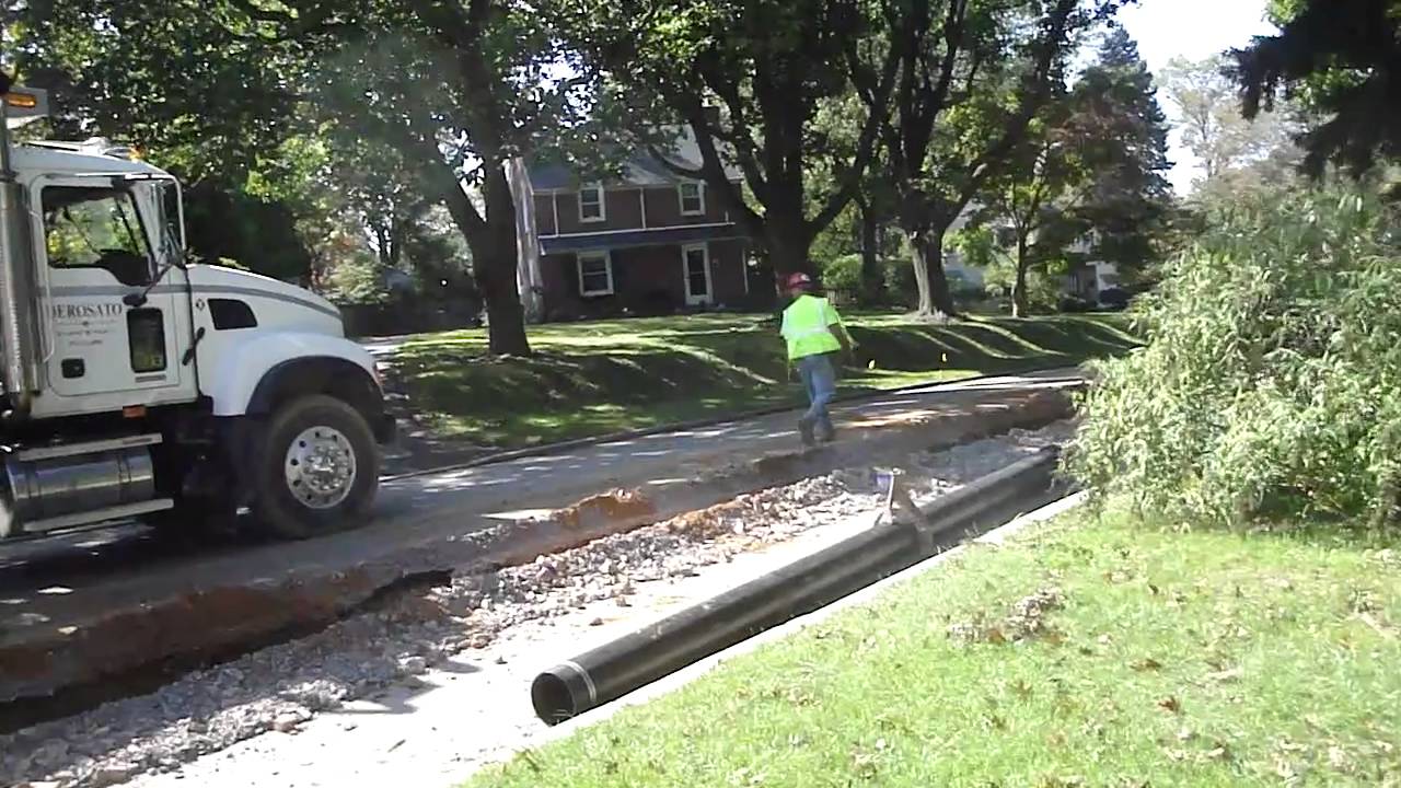 Aqua installing an 8 inch water main in front of my house - YouTube