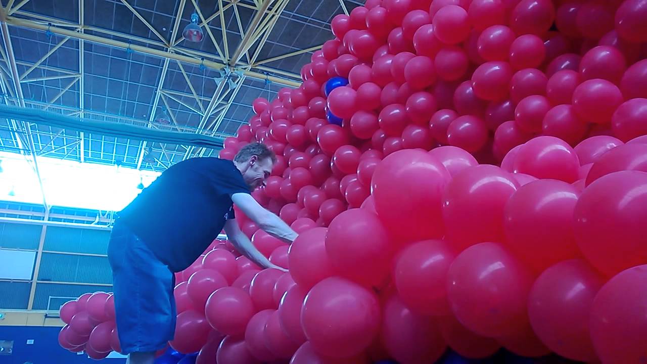 FAIL: Balloon Guy Faceplants through 3 metres of Balloons - YouTube