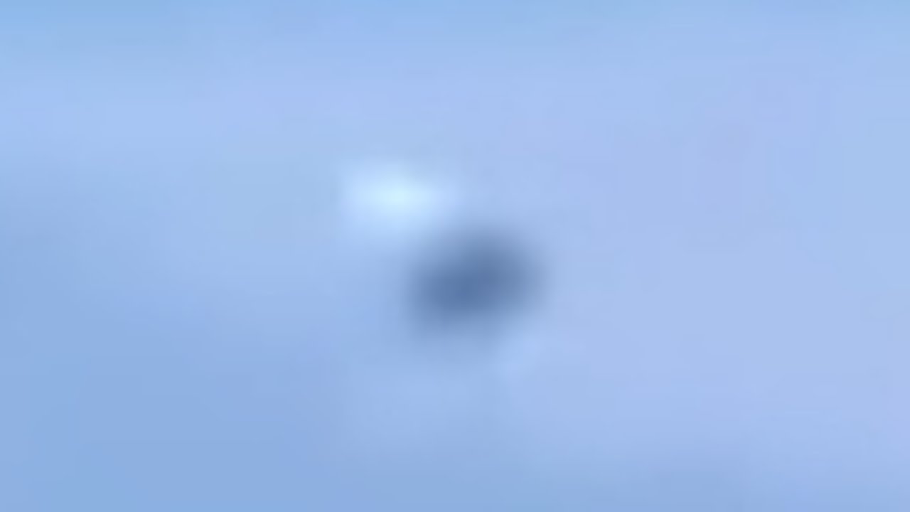 Mass UFO sightings at the beach - Cube Black UAP running up from the ...