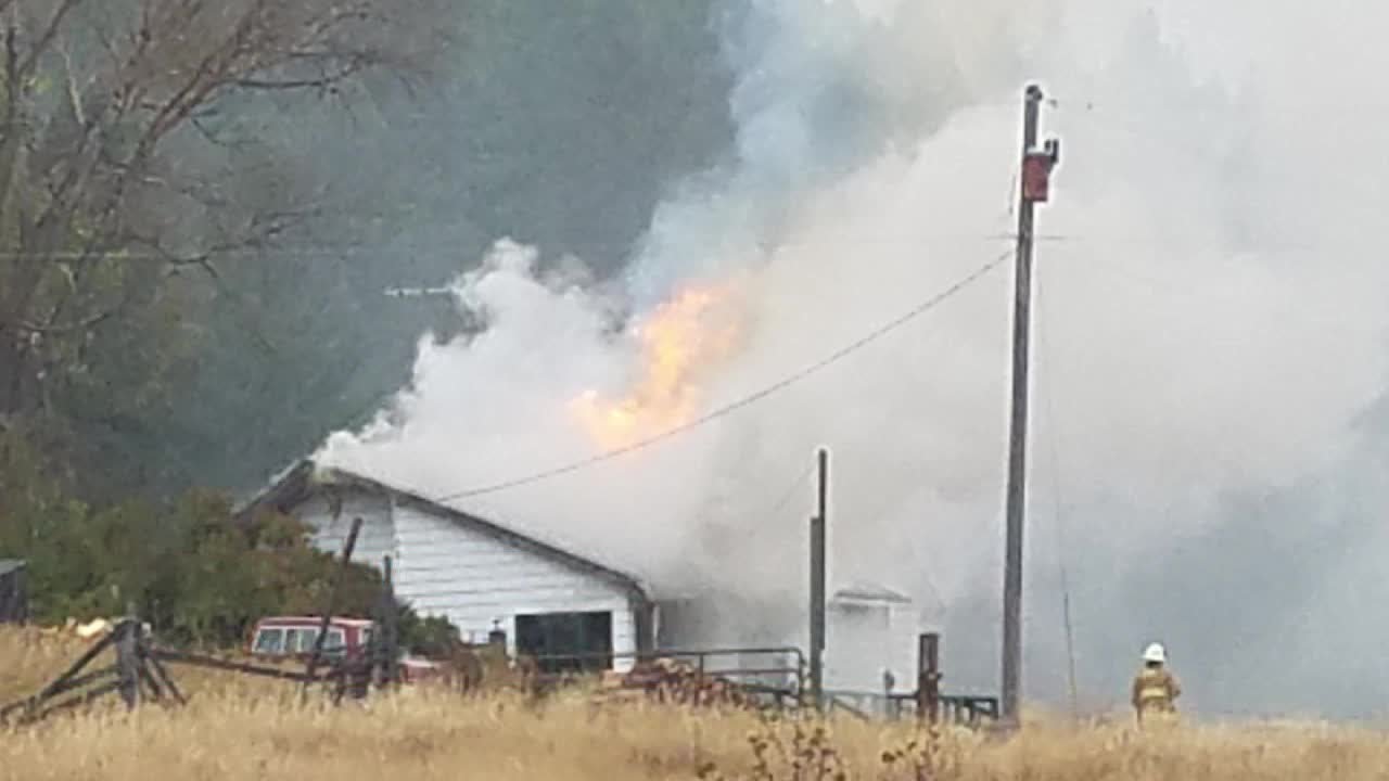 Firefighters battling structure fire near Clancy - YouTube
