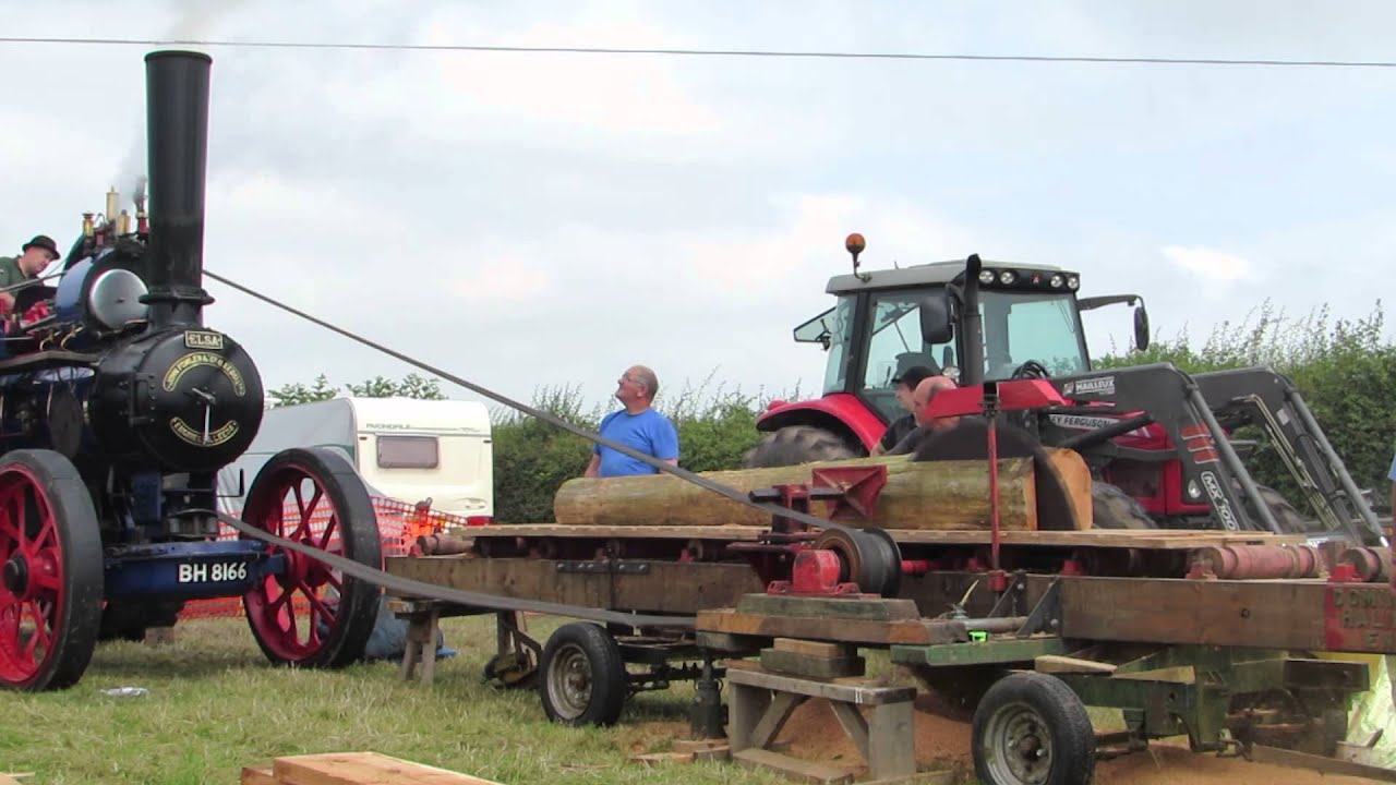 Steam engine powering wood saw - YouTube
