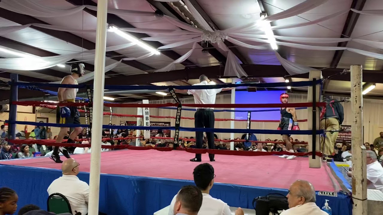 150 lb amateur boxing bout. Blue corner Vincent Navarro be rayan ani ...