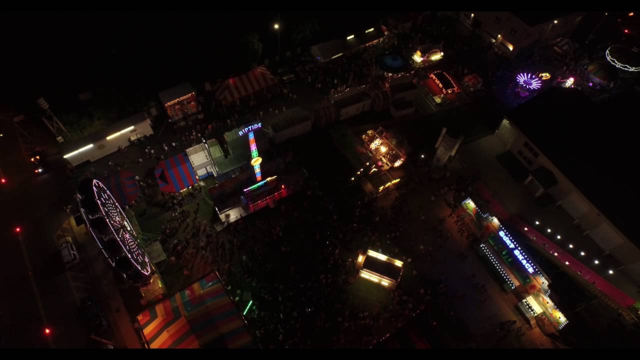 Aerial view of small-town carnival in the evening - YouTube
