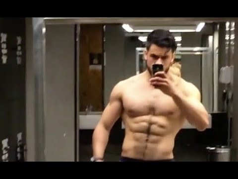 Job flexing his muscles in the locker room - YouTube