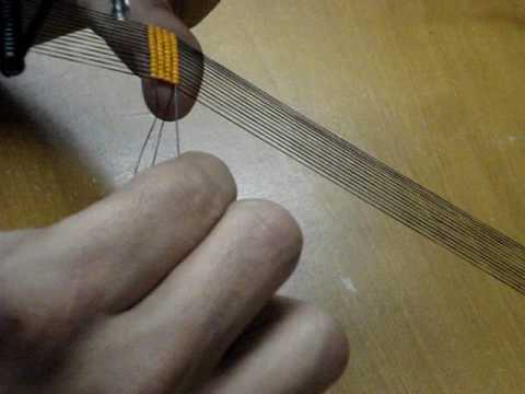How to string beads on a loom - YouTube