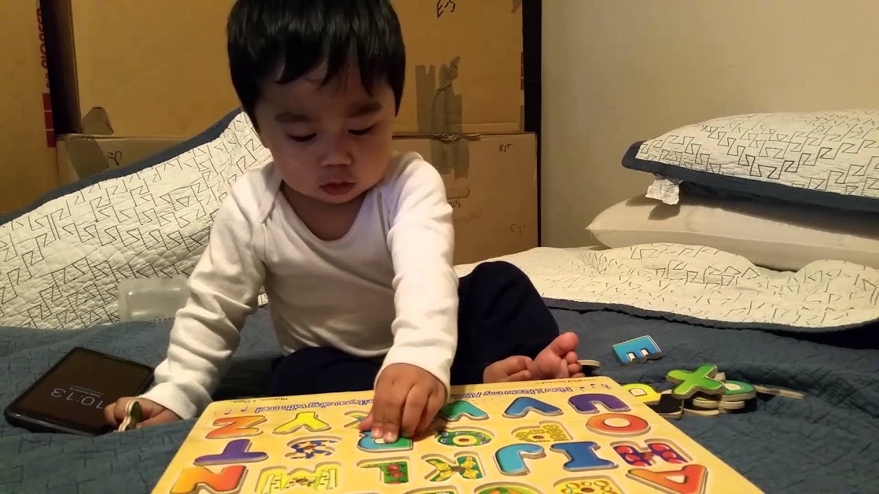 Baby Kian getting better at alphabet puzzle - YouTube