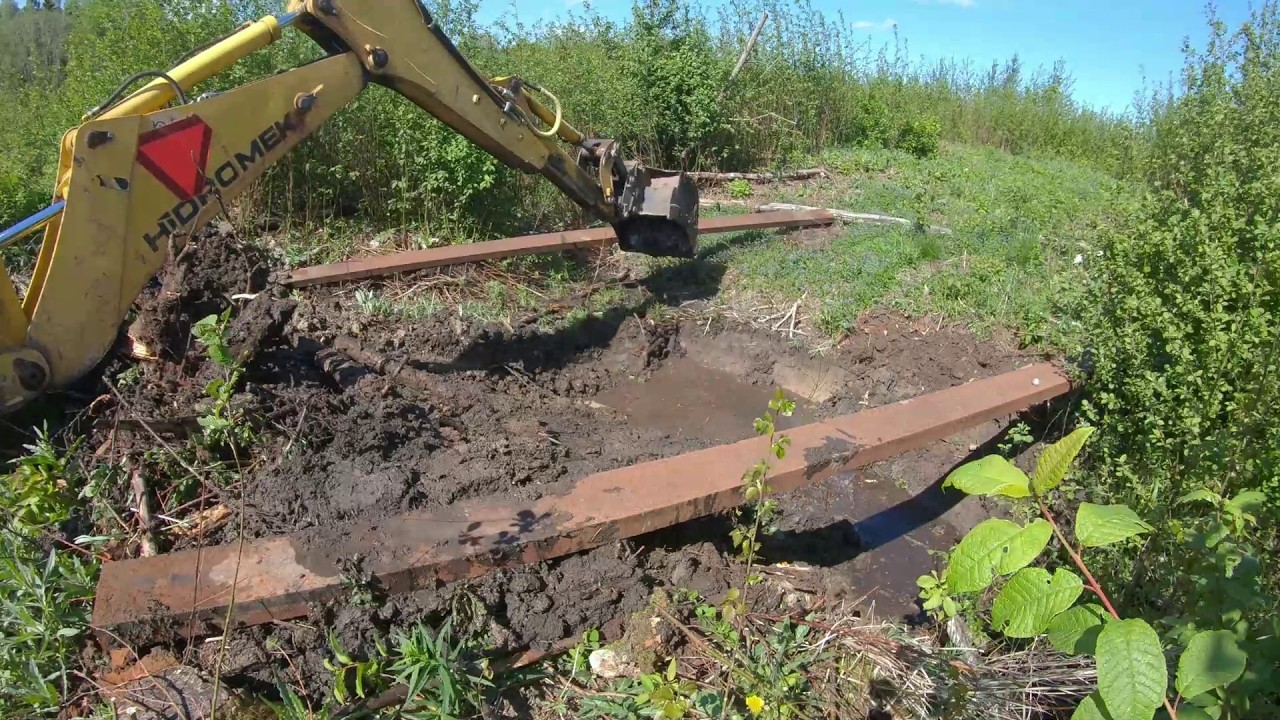 Digging a spring water feature and clearing forest roads - YouTube