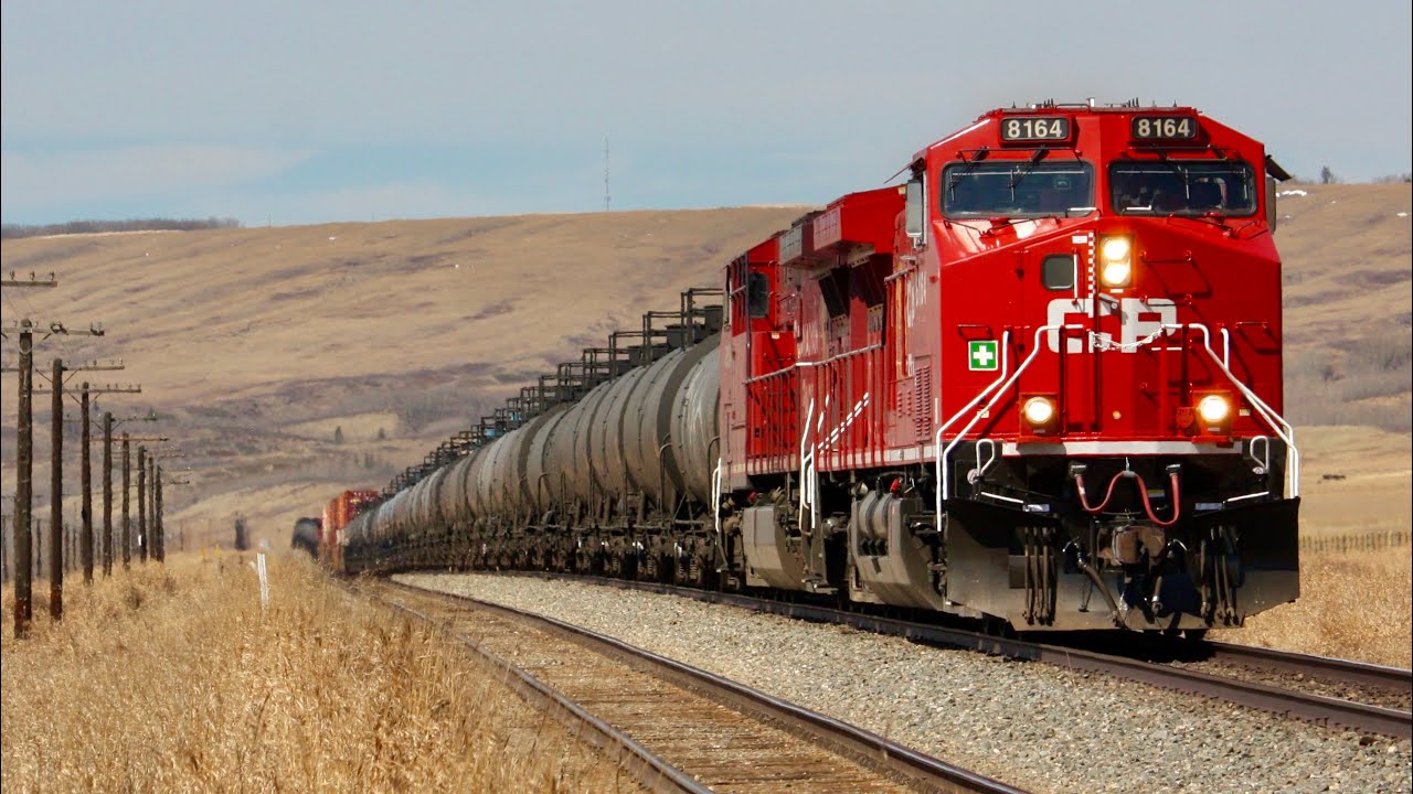 BRAND NEW CP AC4400CWM!!! CP 8164, CP 8064 and CP 9363 lead CP 200 past Bearspaw, Alberta - YouTube