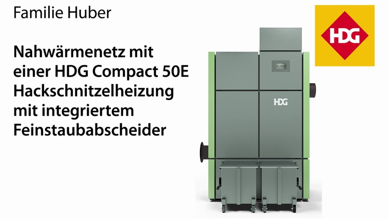 Nahwärmenetz Familie Huber: Hackschnitzelheizung HDG Compact 50 versorgt drei Wohnhäuser - YouTube