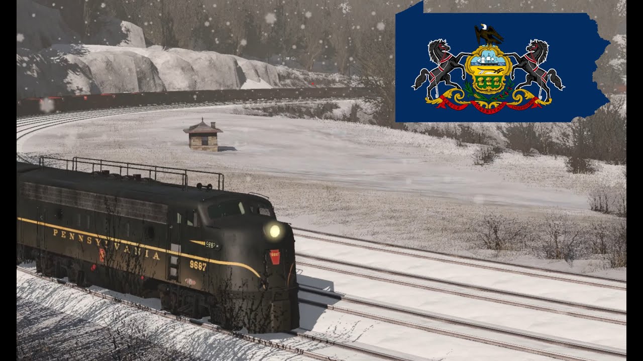 P.R.R DIESEL-POWERED EMPTY HOPPER WESTBOUND WINTER DRAG OVER WORLD FAMOUS HORSESHOE CURVE CIRCA ...