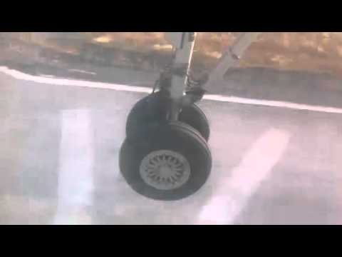 airplane landing - wheel touching ground - YouTube