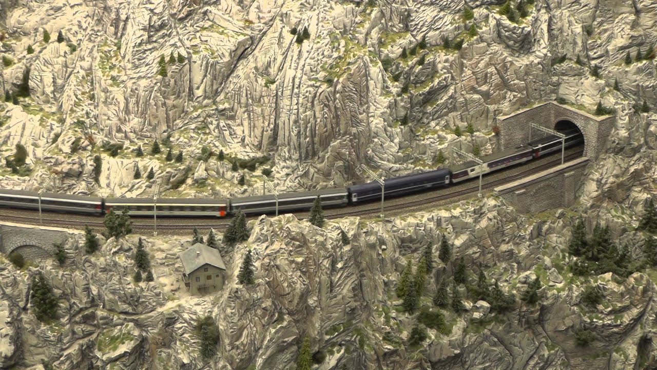 some Swiss HO scale trains high in the Swiss Alps in wonderland."MiWuLa ...