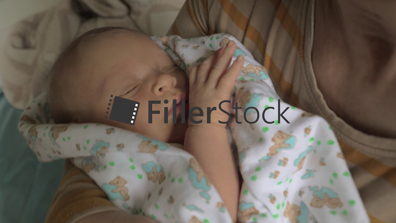 Grandma rocking baby granddaughter in arms - YouTube