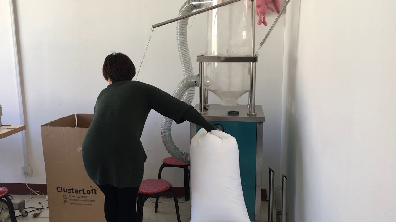 Micro fiber cluster filling by a down filling machine manually - YouTube