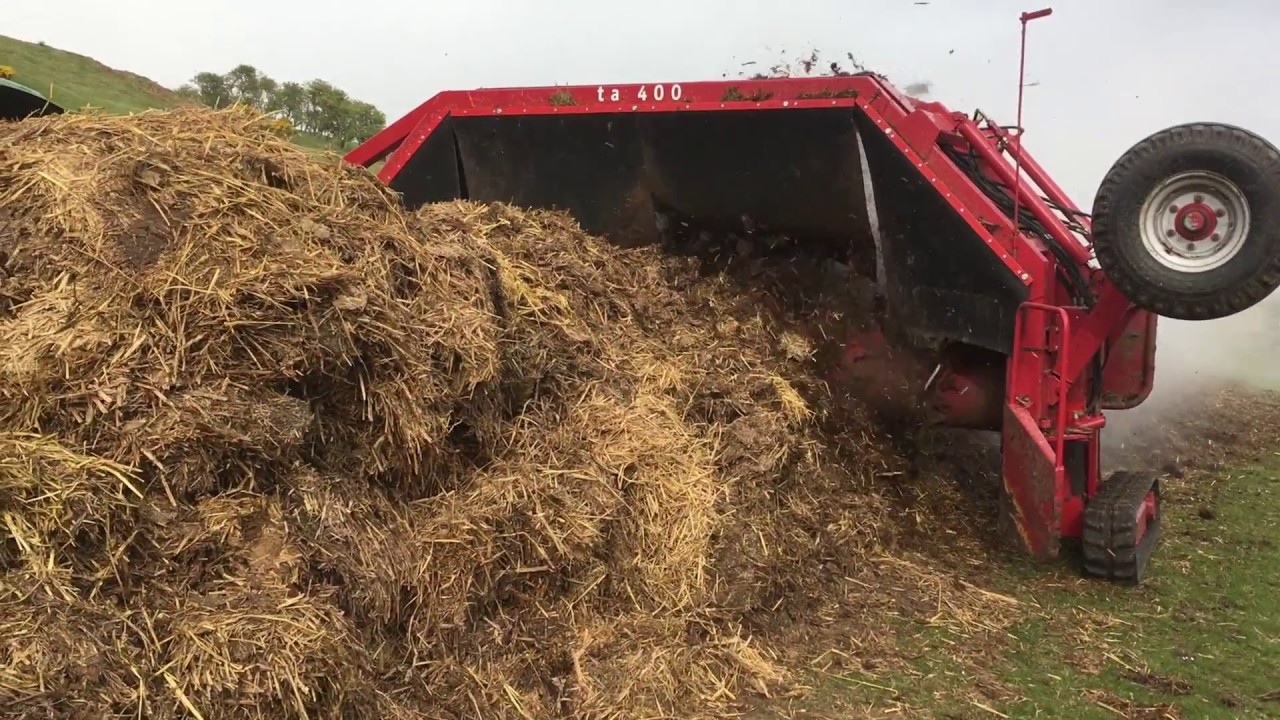 Windrow Turning Manure - Turning Muck - YouTube