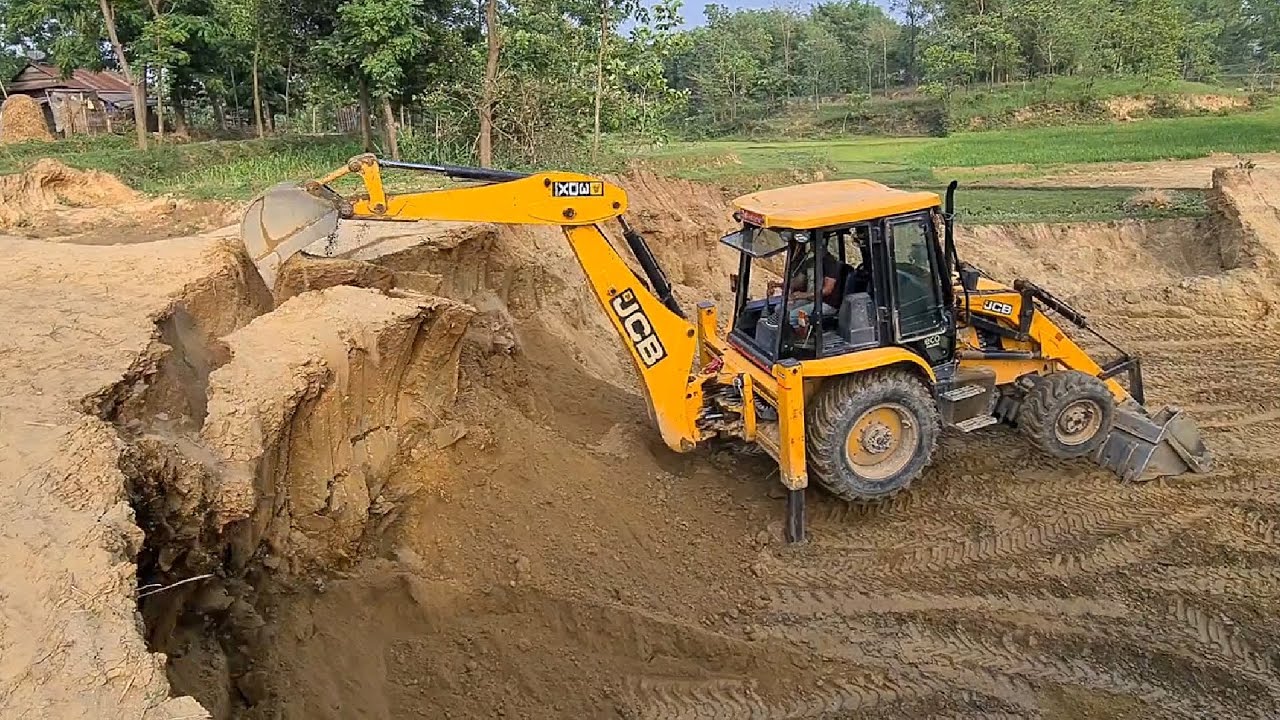 JCB Backhoe Loader Cutting Soil and Loading in Dump Truck- Dump Truck ...