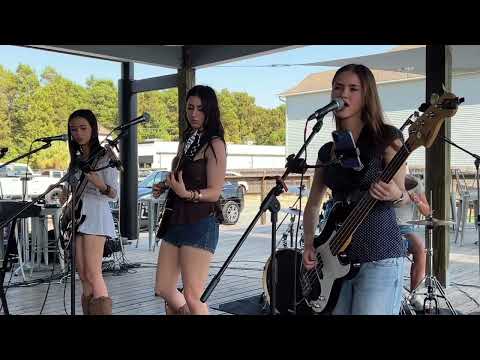 All teen (15-17) all girl rock band performs \