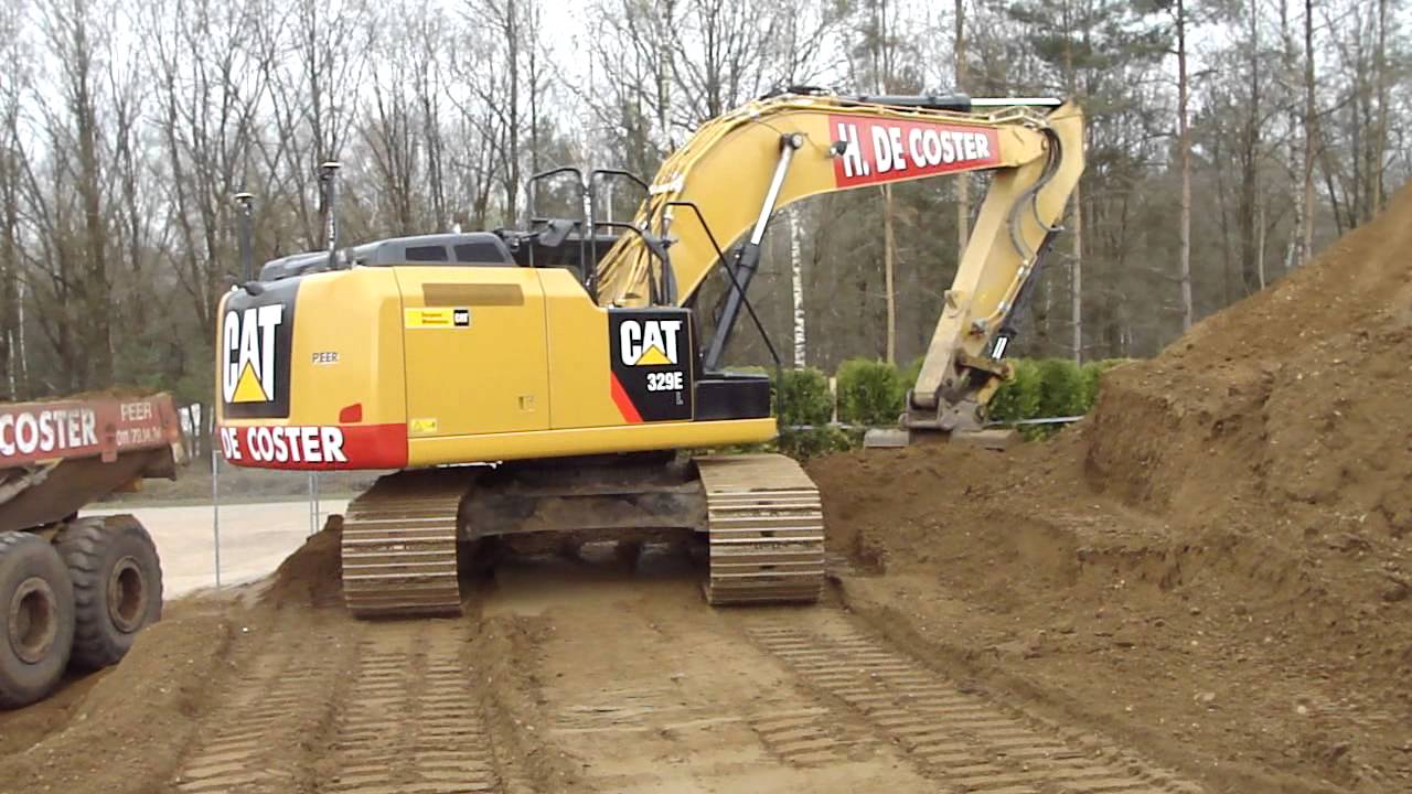 Caterpillar 329e loading a25d - YouTube