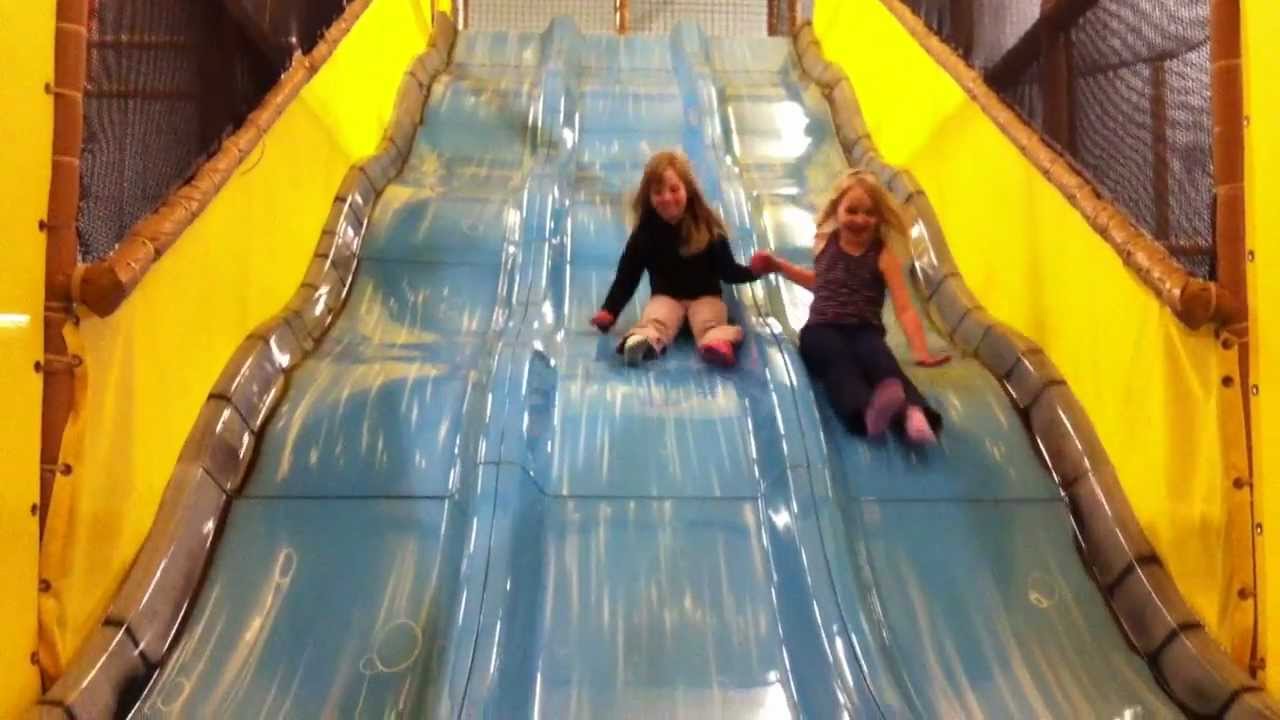Three girls on big slide at Jumping Jiminy's Playland and Cafe - YouTube