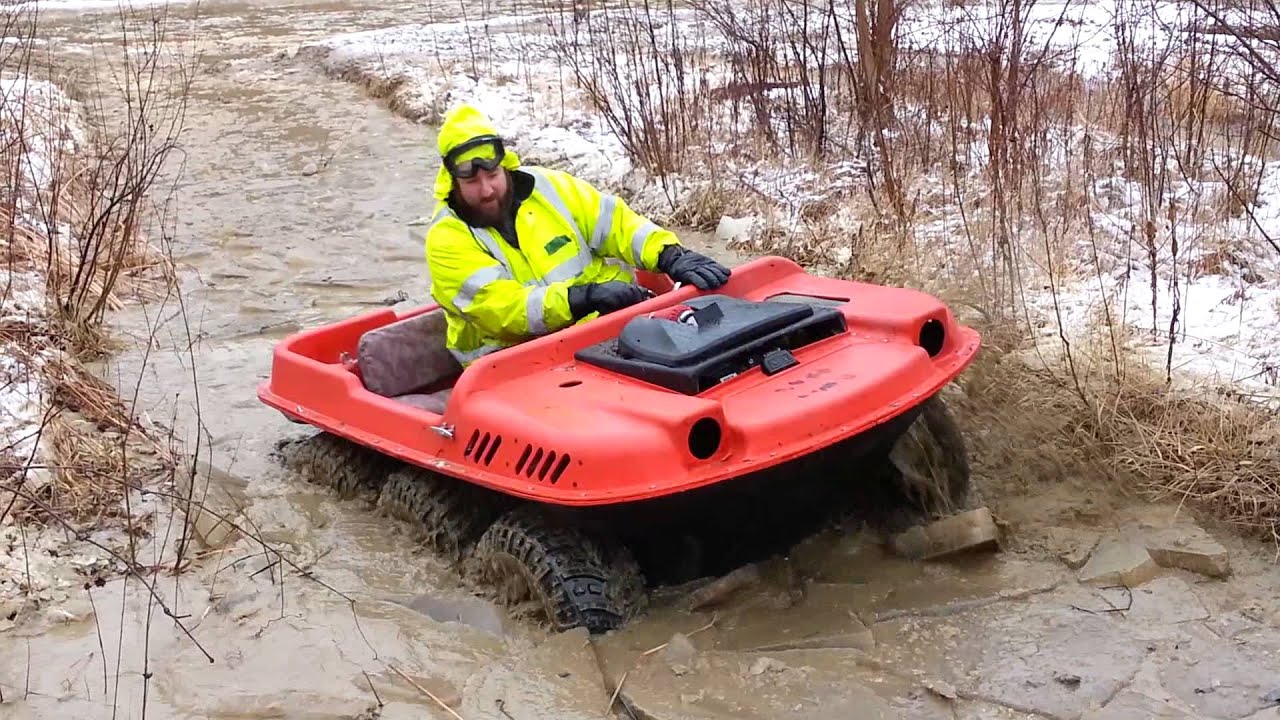 Minion riding a 6x6 old Argo with 20hp v twin in ice, mud and water ...