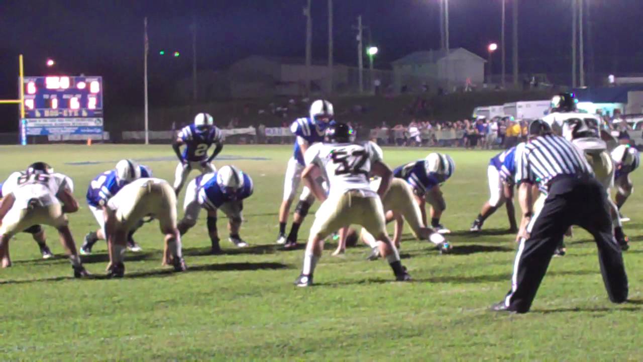 The offense line pushes hard to help quarterback Brock McCoin sneak in ...