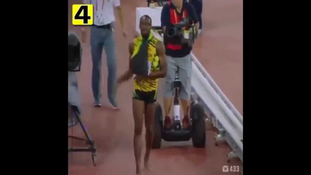 Usain Bolt fall - Chinese Cameraman falls on Usain Bolt after men's 200 ...
