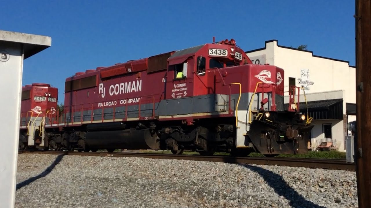 RJ Corman 3438 (Loud K5LA) leads Trio W/ Grain & Hopper Cars - Powell ...
