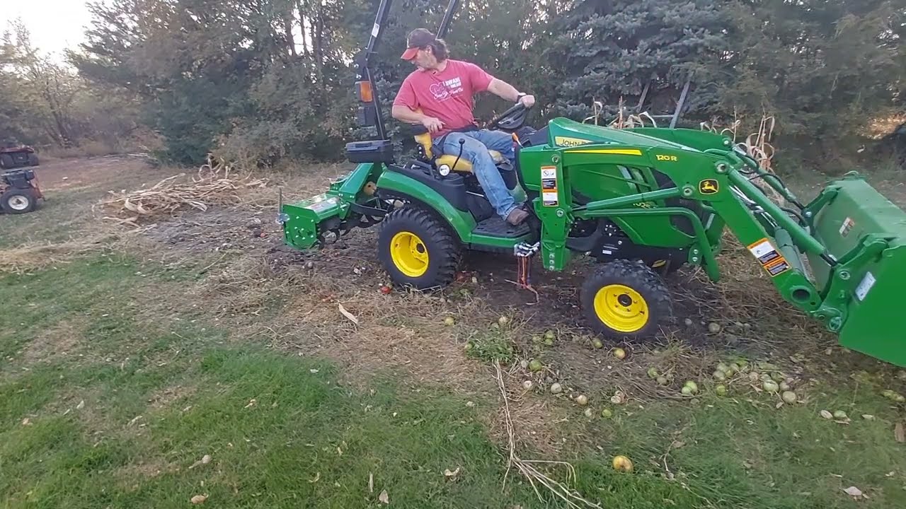Tilling of the garden with the John Deere 1025R, starring Captain ...