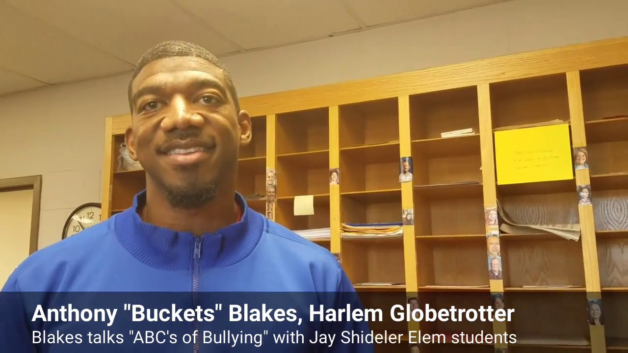 Harlem Globetrotter delivers anti-bullying message to Jay Shideler students