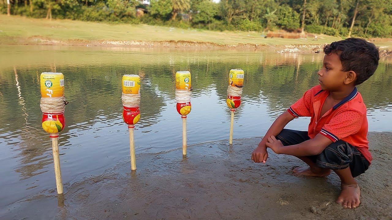 Traditional Boy Catching Big fish With Plastic Bottle Fish Hook By ...
