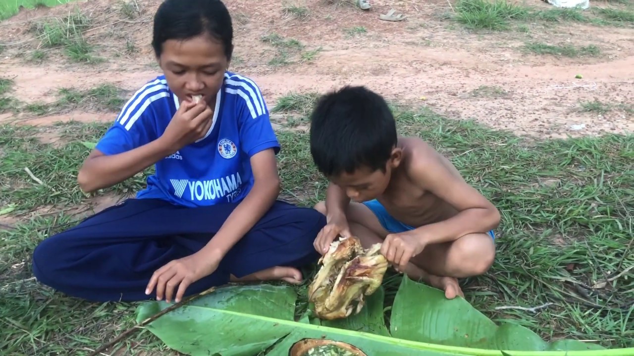 primitive eating delicious burn chicken in a jar and spicy chili sauce ...